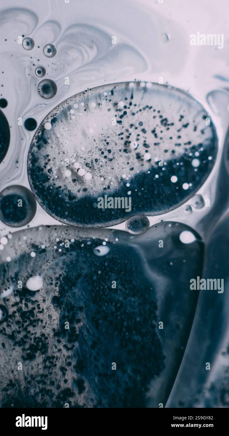 Particles floating in black liquid hi-res stock photography and images ...