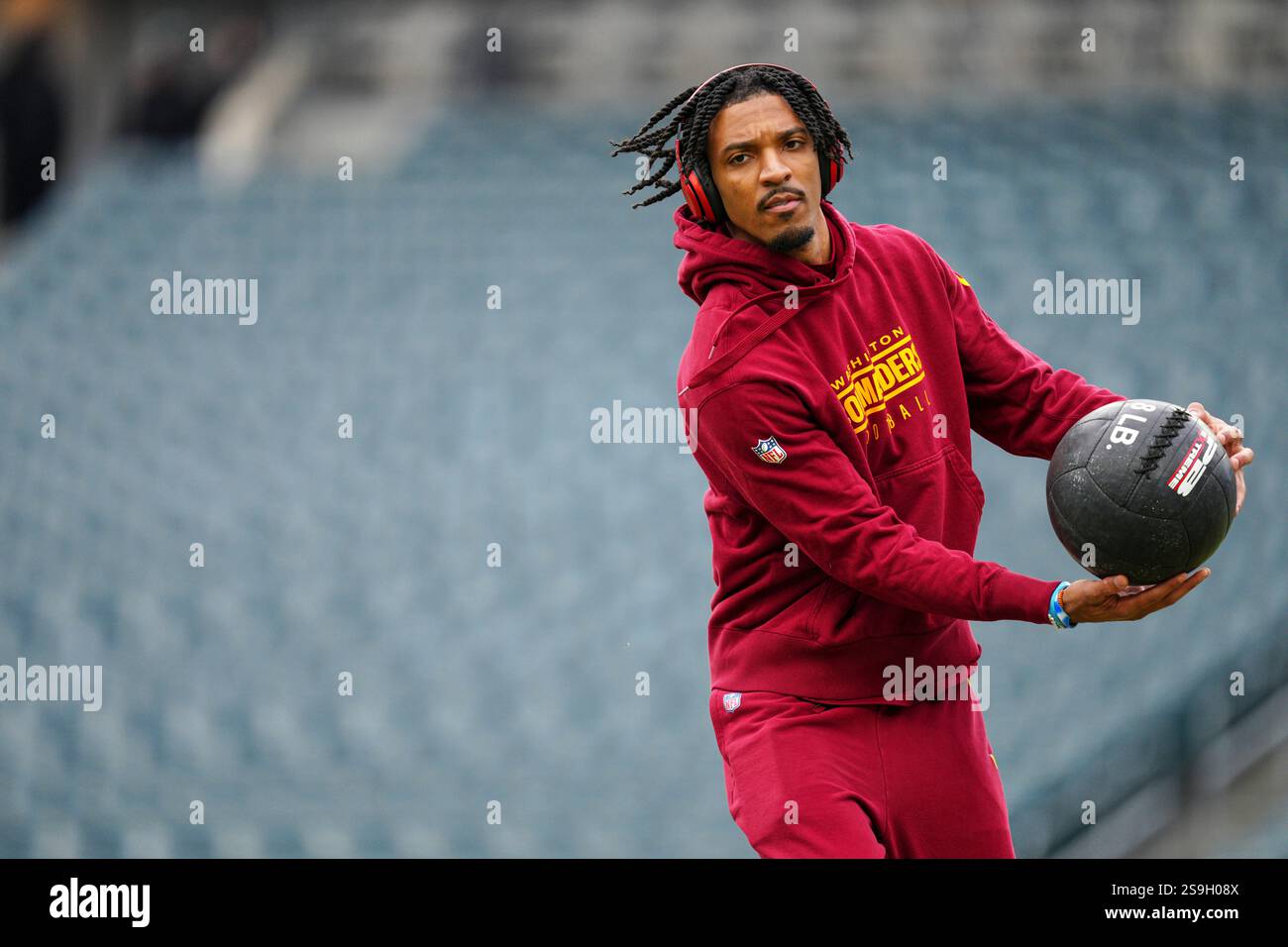 Washington Commanders quarterback Jayden Daniels warms up before the ...