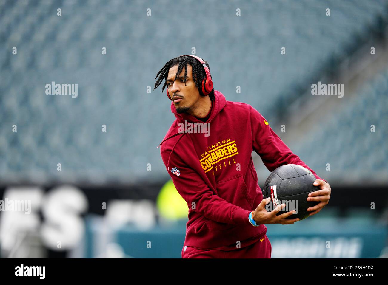 Washington Commanders quarterback Jayden Daniels warms up before the ...