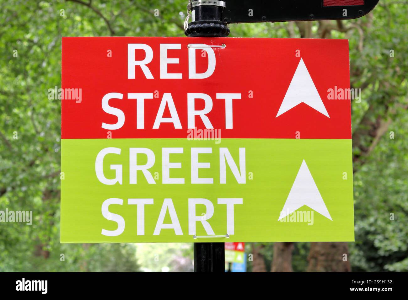 Board with arrows indicating directions to red and green start Stock ...