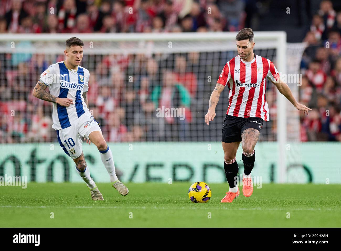 Daniel Raba of CD Leganes competes for the ball with Yeray Alvarez of ...