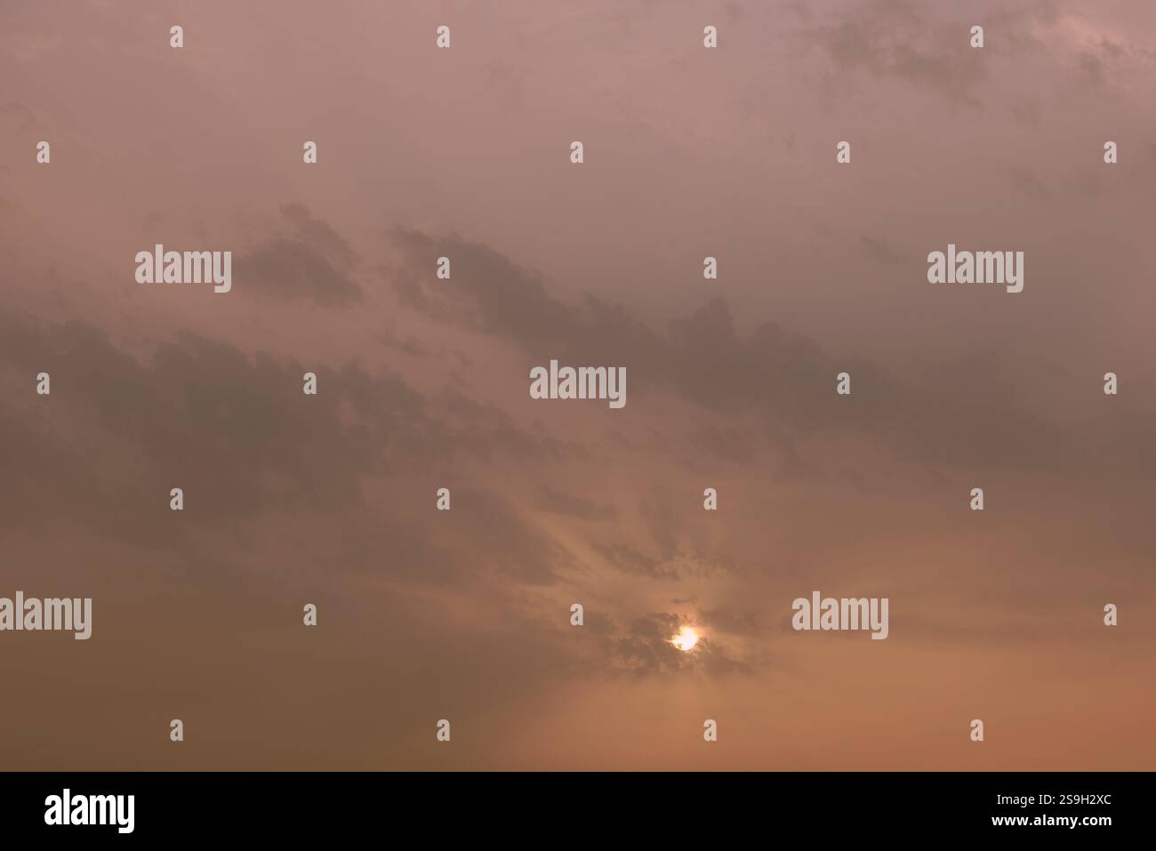 Sky, with diffused sun clouds colourful Stock Photo - Alamy