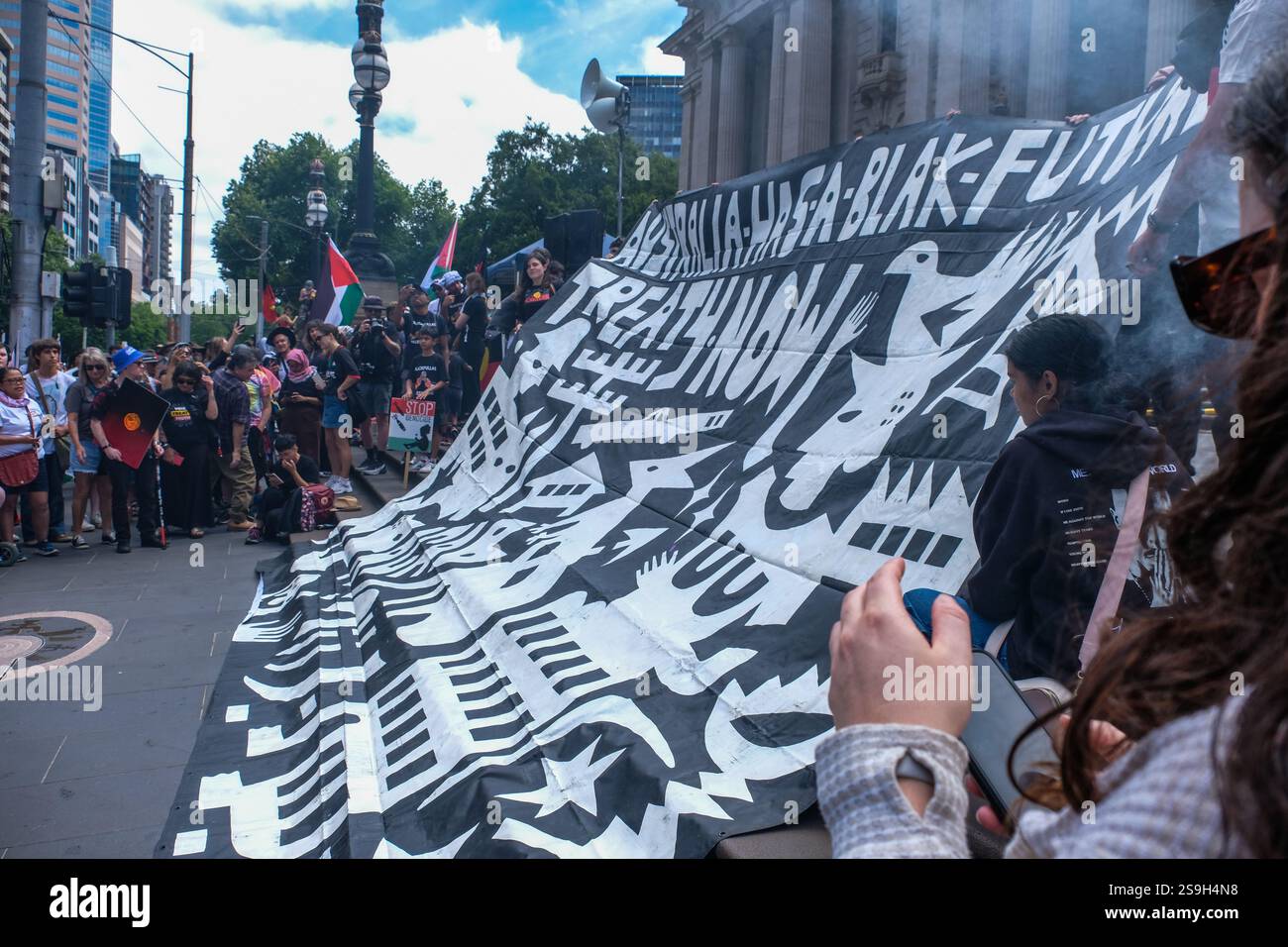 Large banner created by indigenous artist is seen during "Invasion Day ...