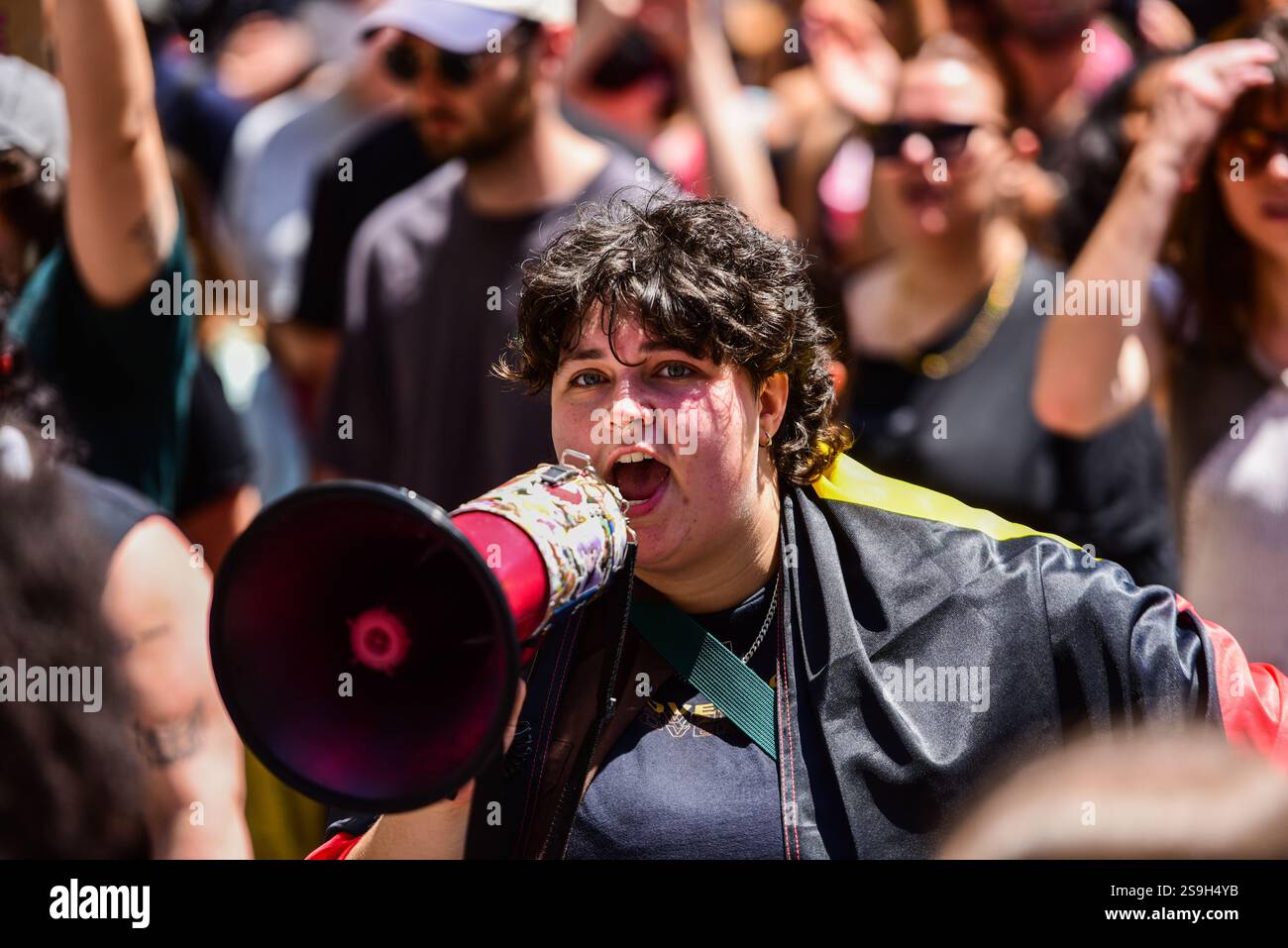 A protester chants through a megaphone during "Invasion Day" rally ...