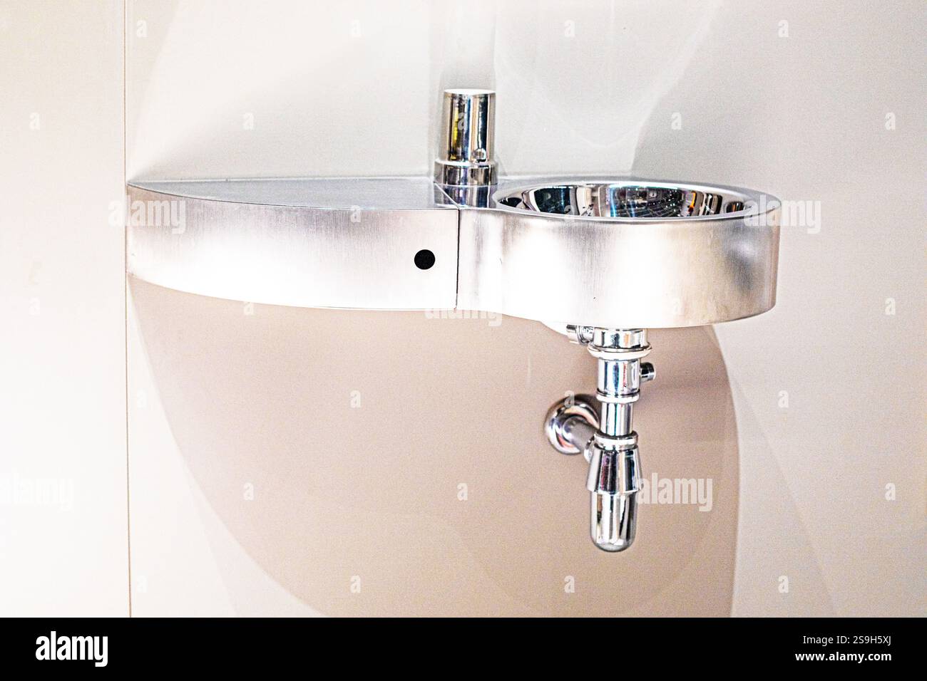 stylish sink with tap on light background in interior Stock Photo - Alamy