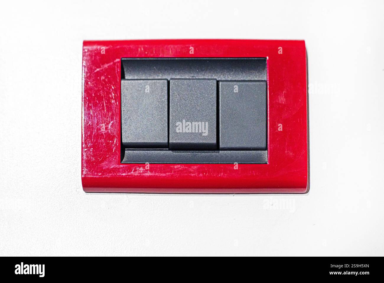red stylish switch on a light background in the interior Stock Photo ...