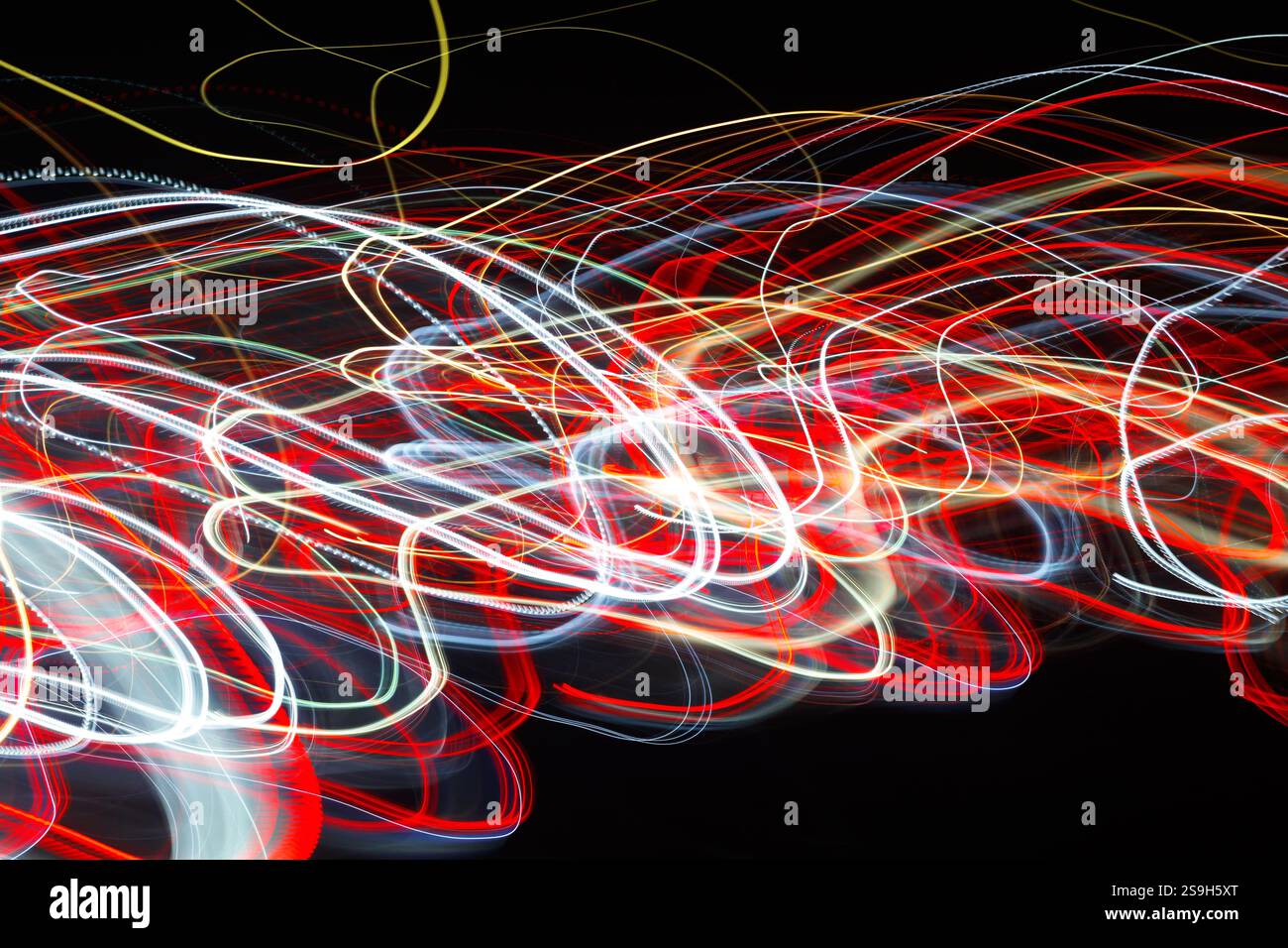 Abstract blurred colorful light effect on a black background. Long ...