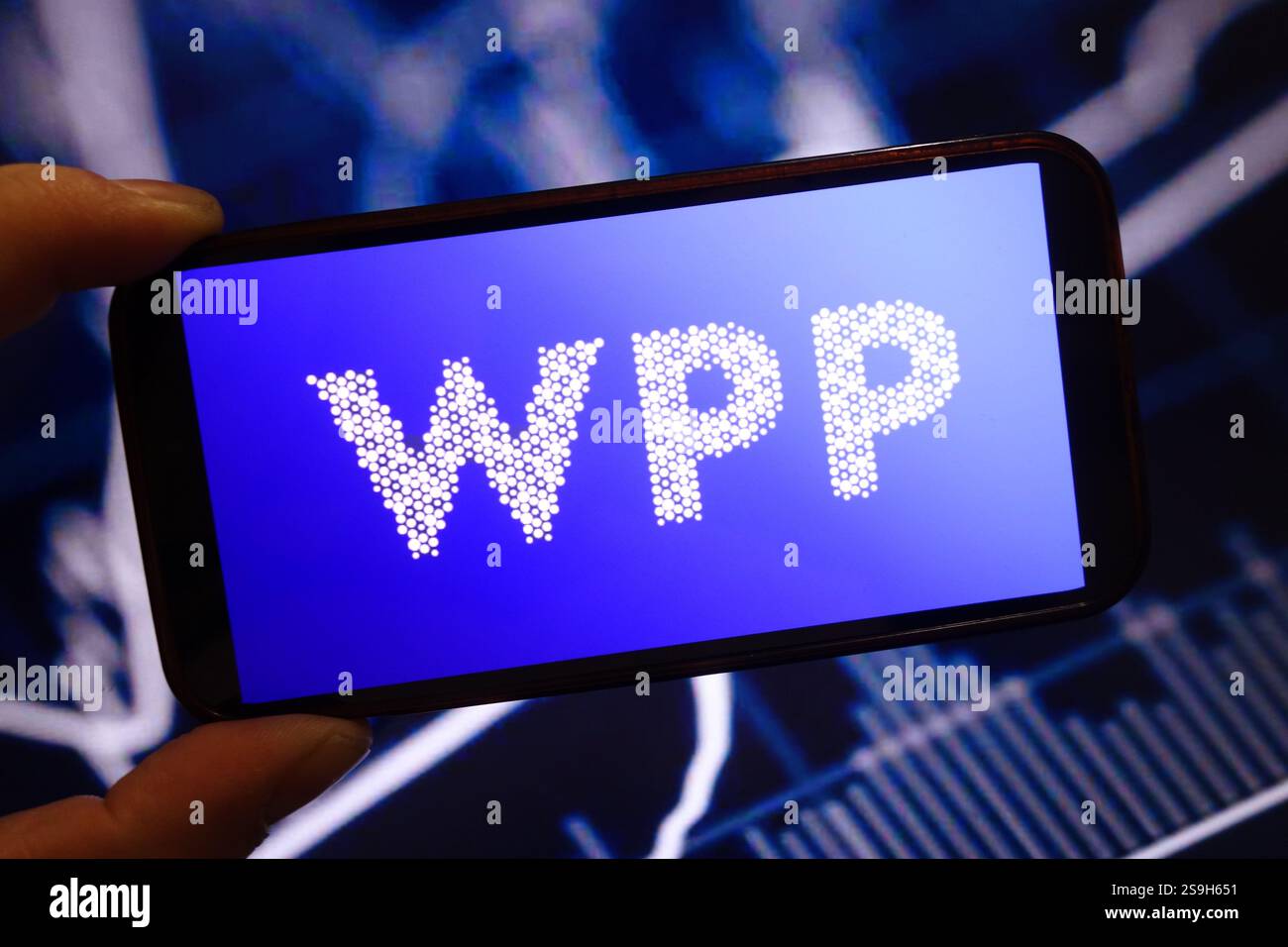In this photo illustration, the WPP plc company logo is seen displayed on a smartphone screen ...