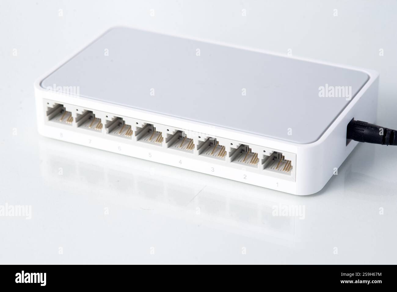 Ethernet network switch with eight ports on a clean background, used ...