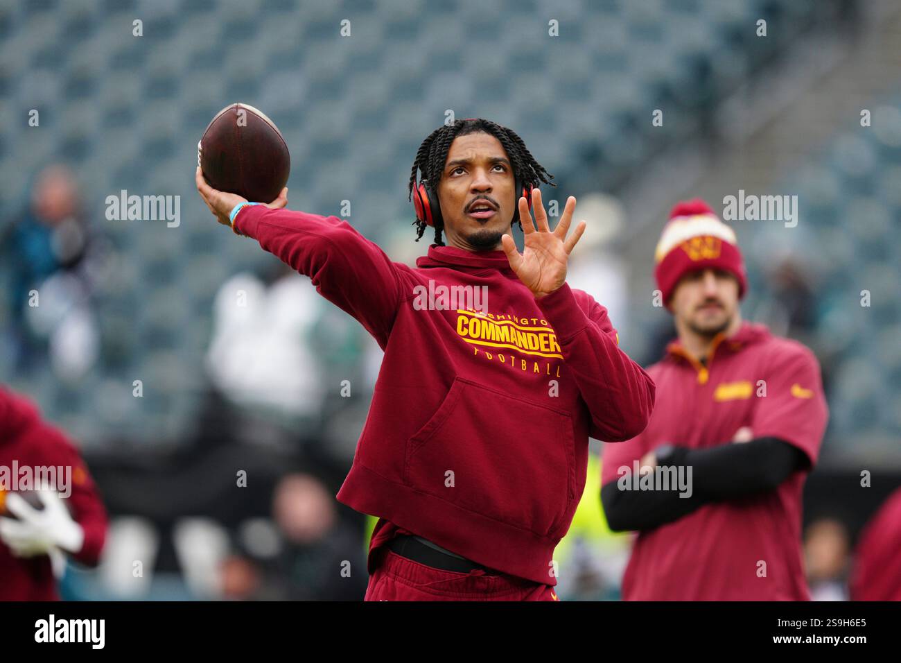 Washington Commanders quarterback Jayden Daniels warms up before the ...