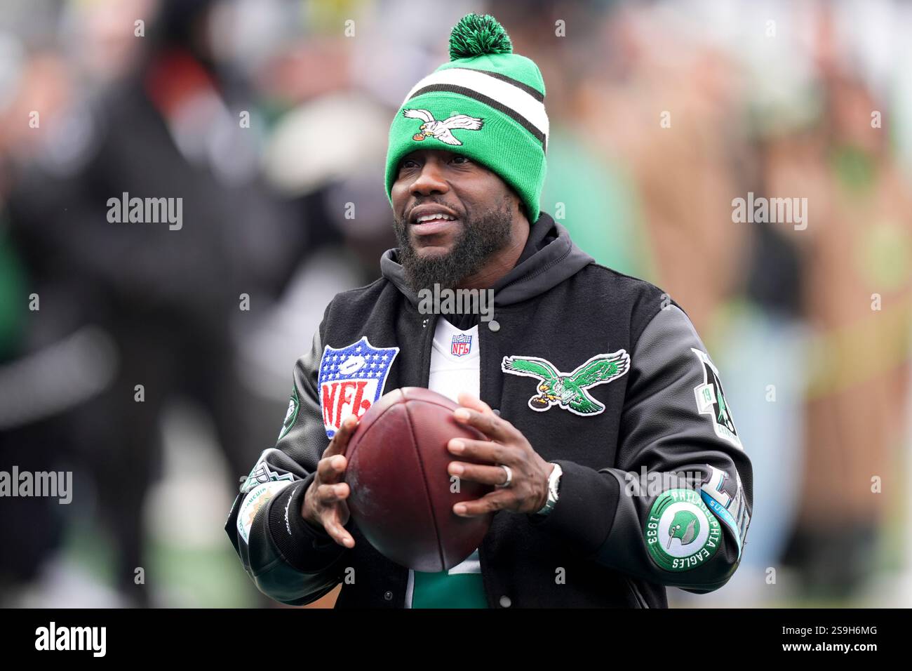 Actor Kevin Hart watches during warm ups before the NFC Championship ...