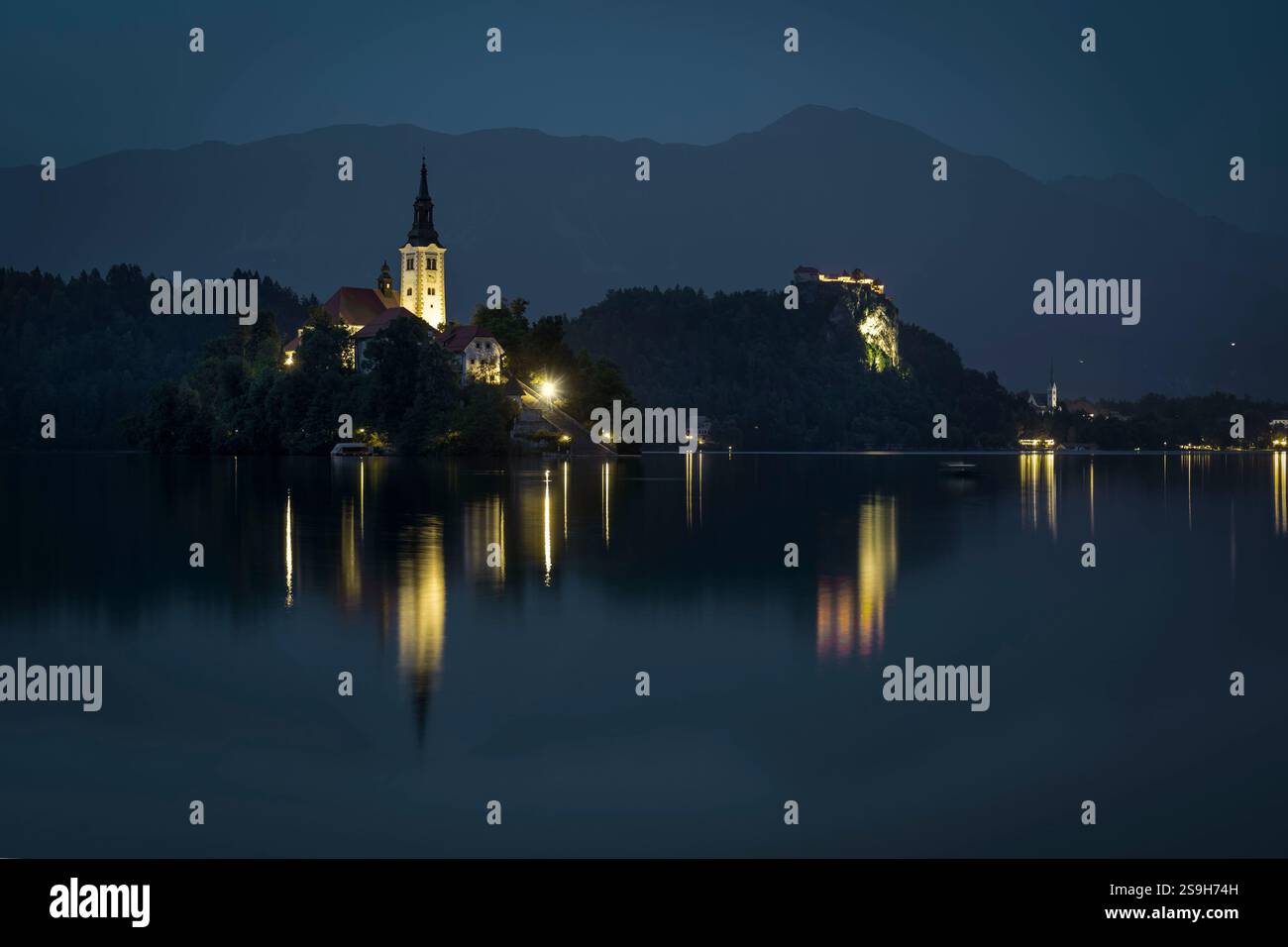 Lake Bled at night with reflections Stock Photo - Alamy