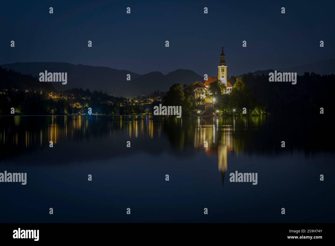 Lake Bled at night with reflections Stock Photo - Alamy
