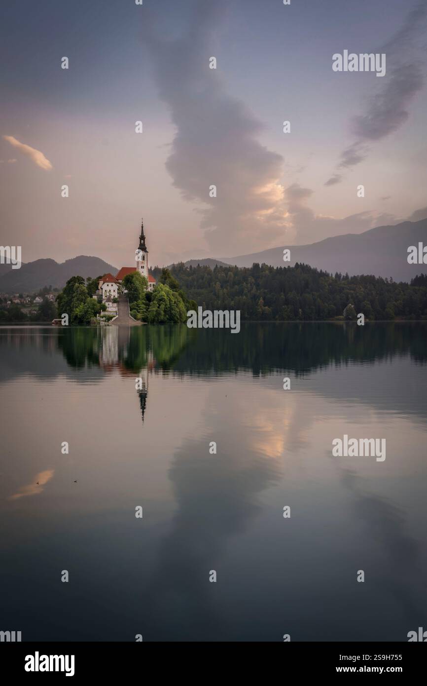 Lake Bled during golden hour sunrise with reflections Stock Photo - Alamy