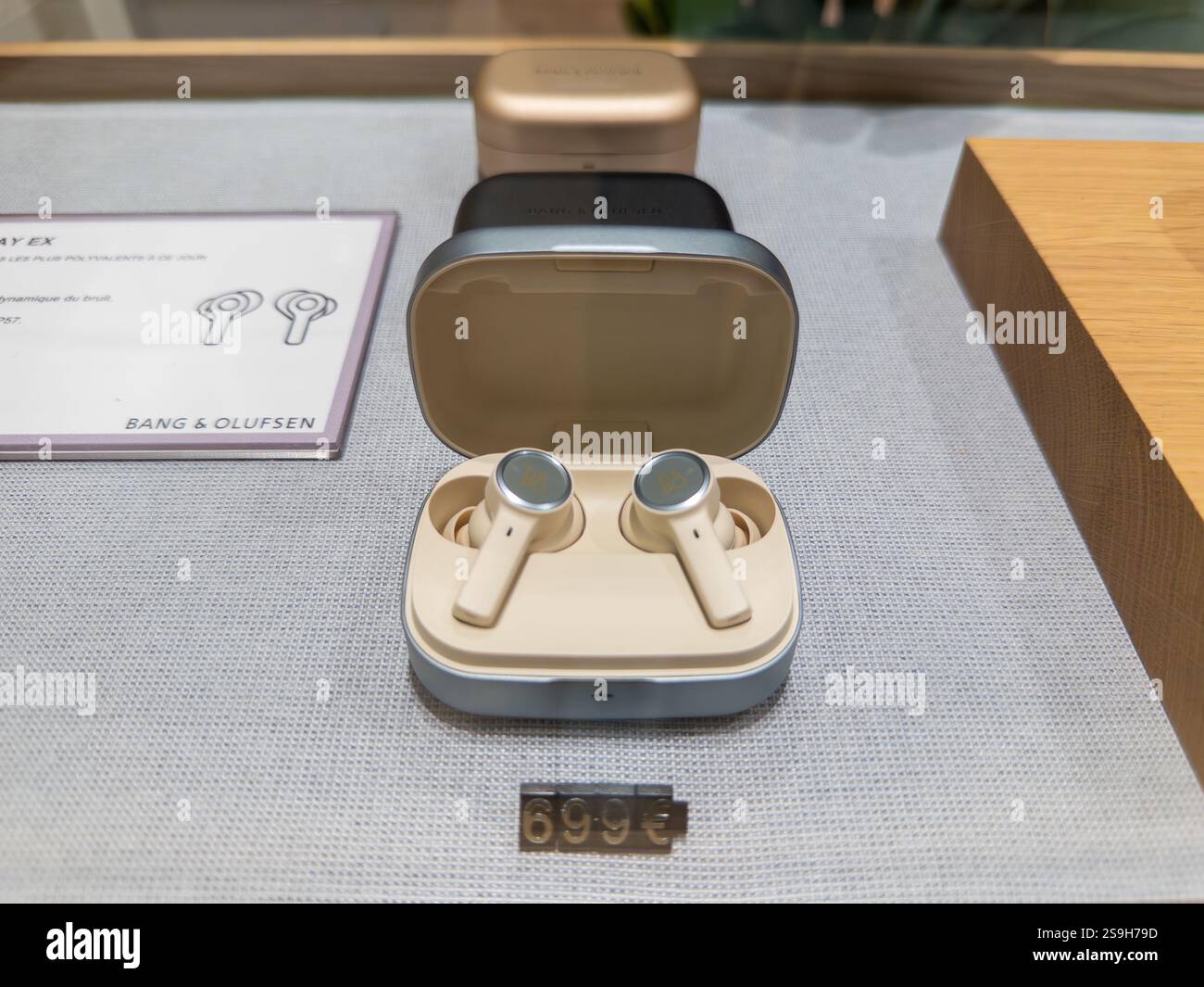 Stylish wireless earbuds on display at an elegant showcase in a tech ...