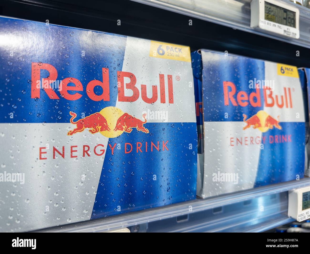 Refreshing energy drink packs stored in a display fridge in a ...