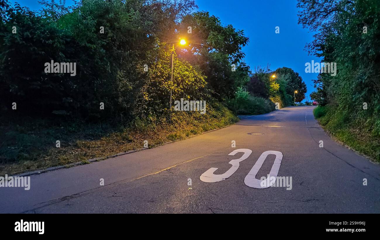 Speed limit 30 km hour. Mark on the road Stock Photo - Alamy