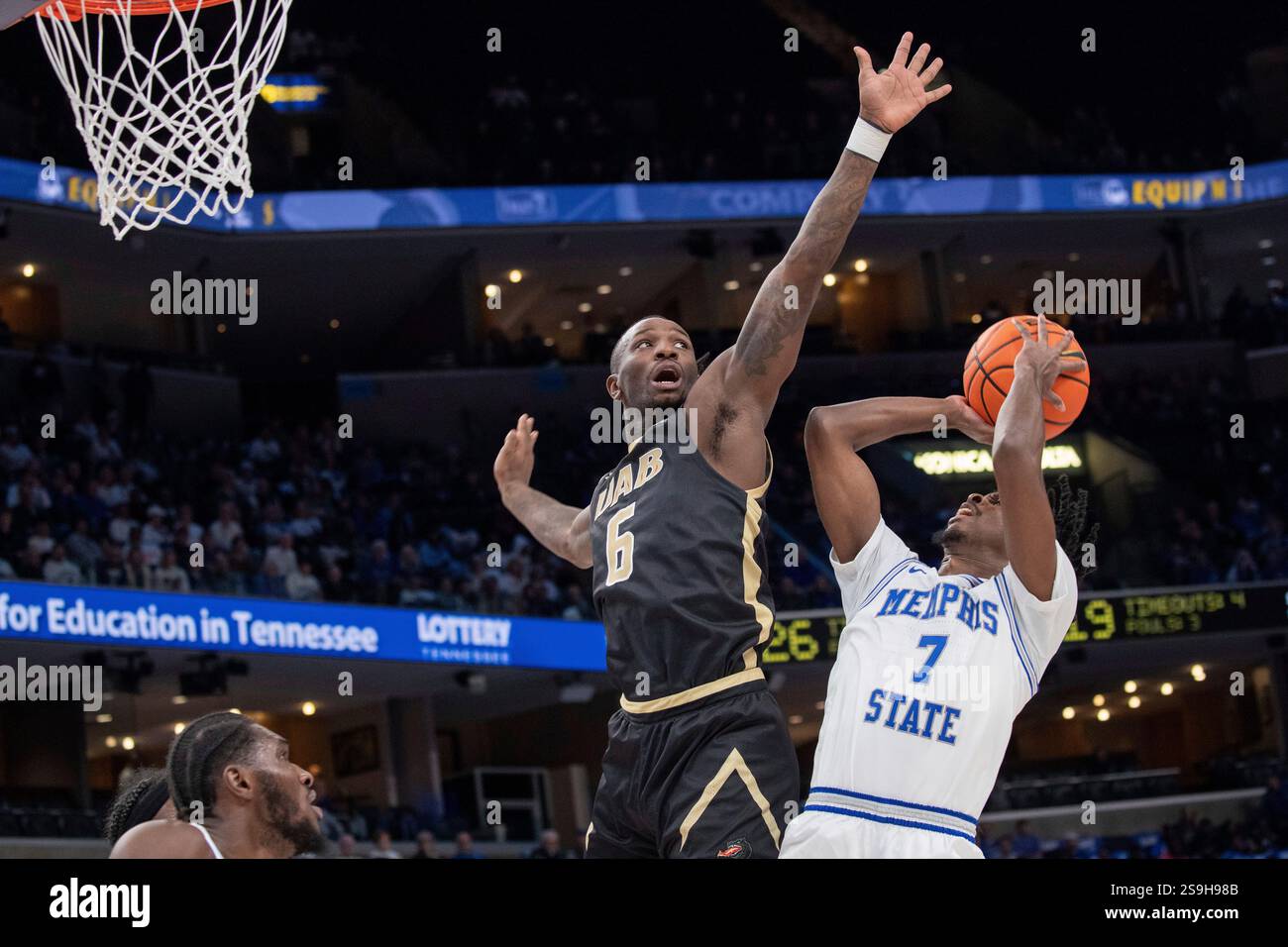 UAB guard Tony Toney (6) defends a shot attempt by Memphis guard PJ ...