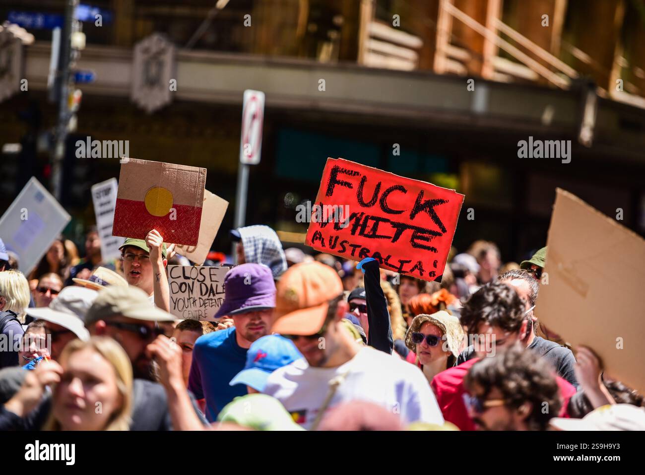(EDITOR'S NOTE : Image contains profanity)A racist protester holds a ...
