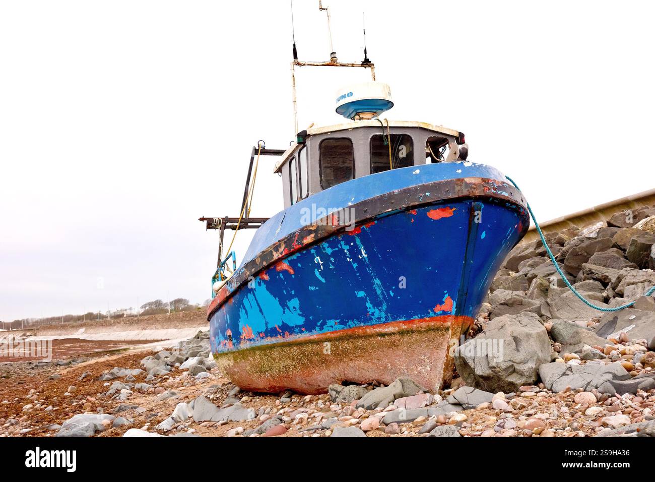 A small inshore fishing boat ripped from its moorings during a storm ...