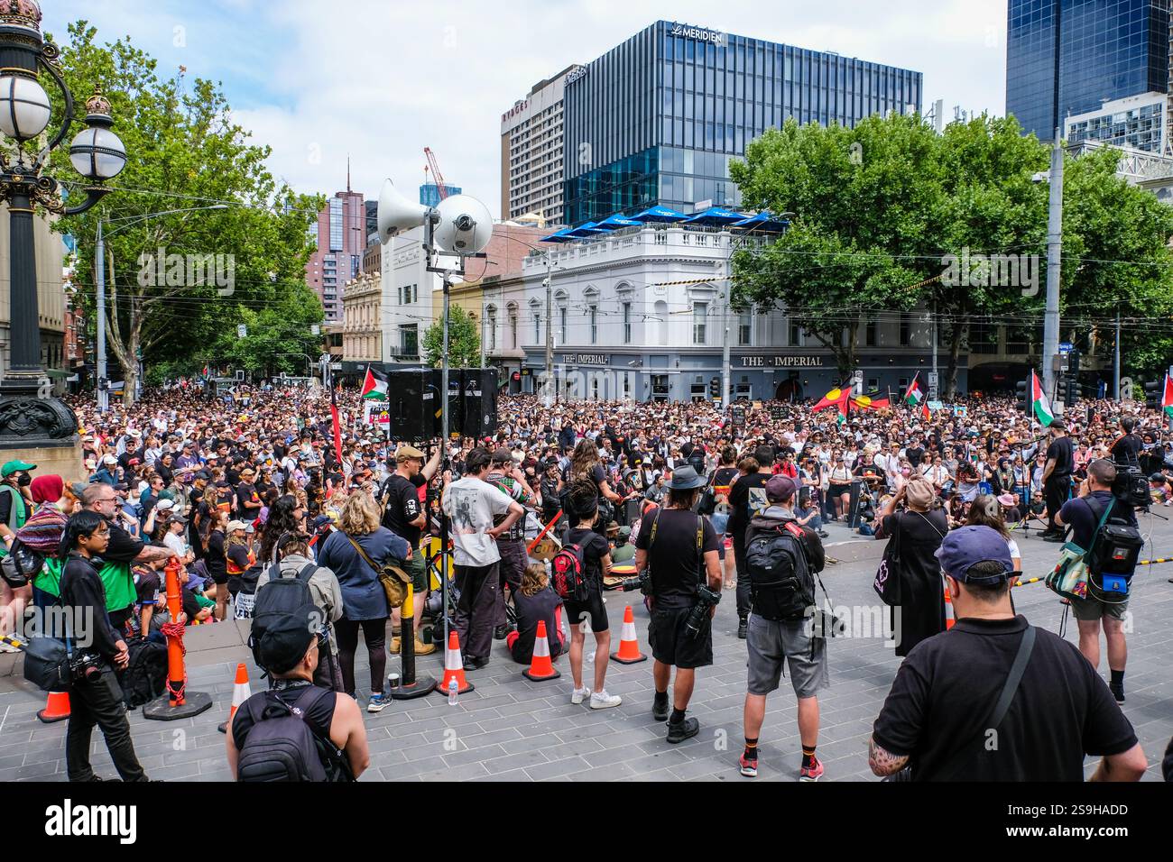 Thousands of protesters and media representatives are seen during ...
