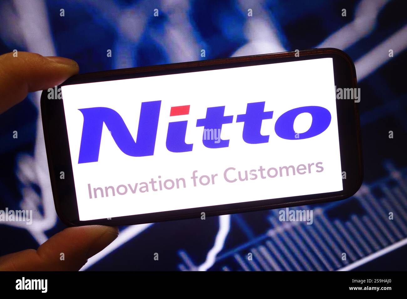 In this photo illustration, the Nitto Denko company logo is seen ...