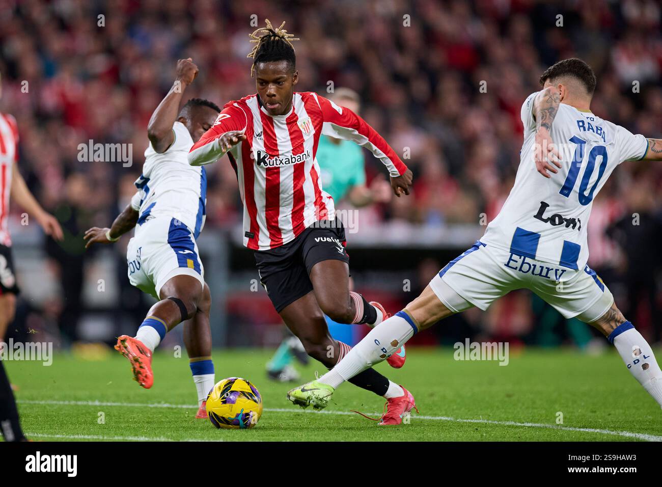 Nico Williams of Athletic Club competes for the ball with Daniel Raba ...