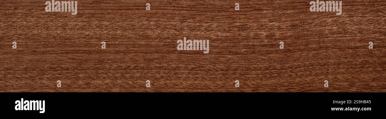 Mahogany veneer surface with a smooth finish and warm, deep brown tones ...