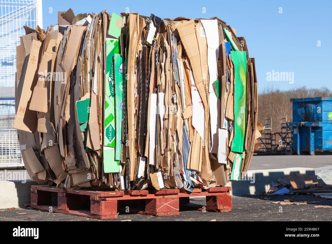 Neat bale of flattened cardboard boxes and retail packaging ready for ...