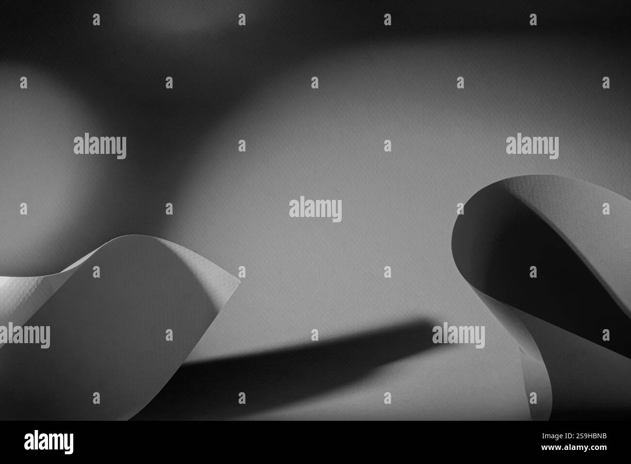 Minimalistic black and white abstract composition of paper curves and ...