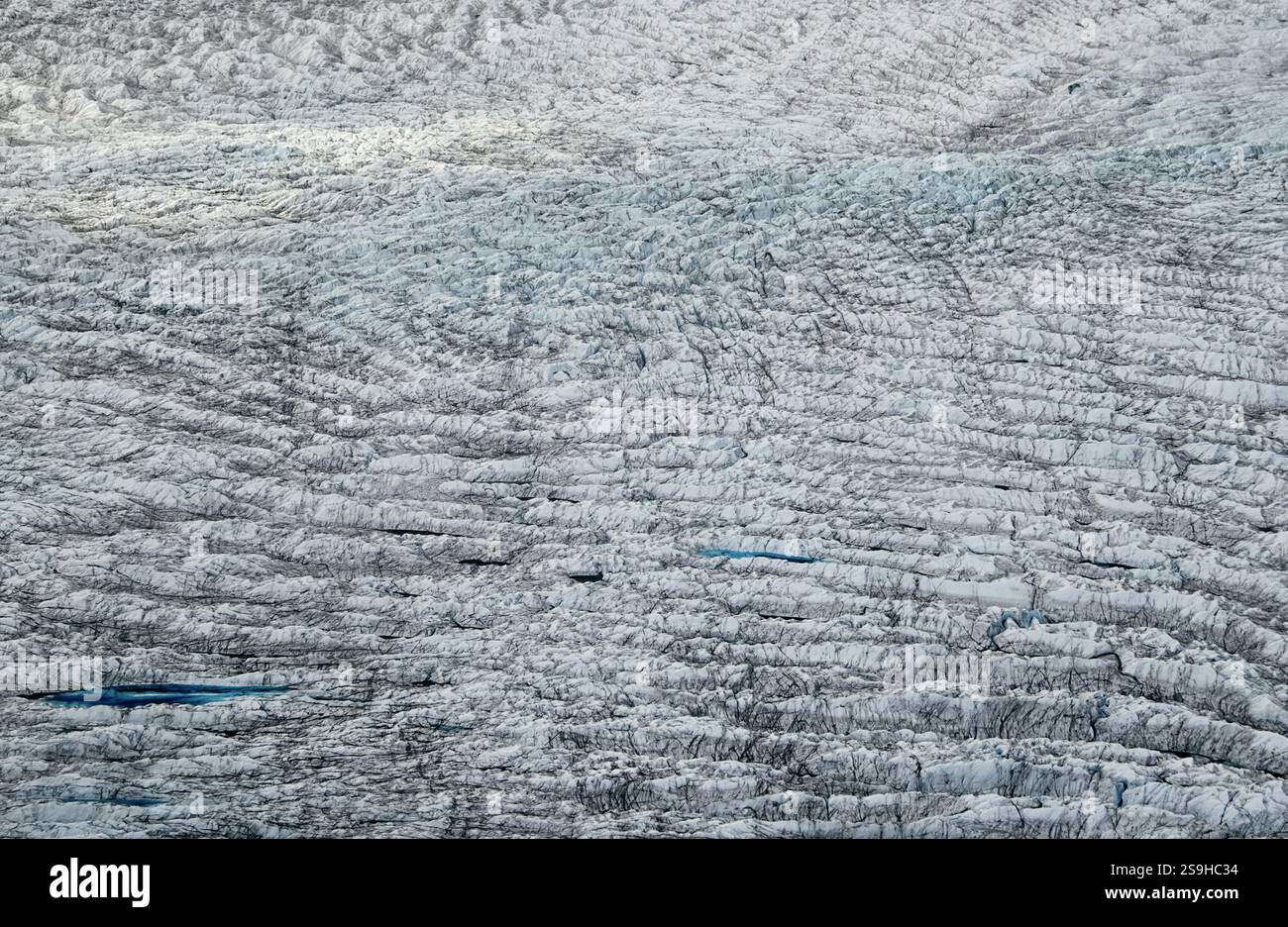 Over the Greenland Ice Sheet. Aerial view of the endless ice sheet to ...