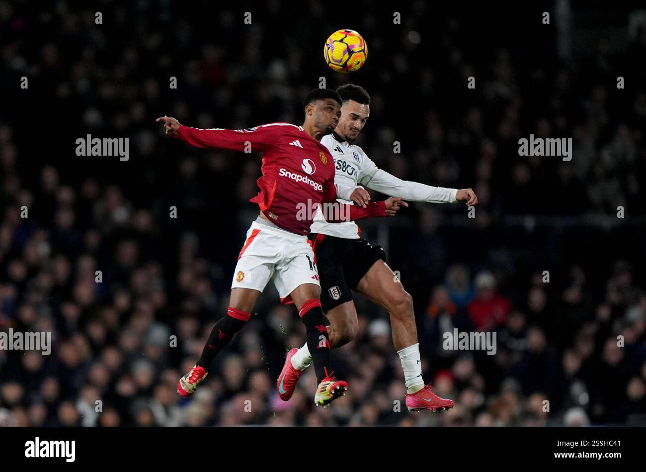 Manchester United's Amad Diallo (left) and Fulham's Antonee Robinson ...