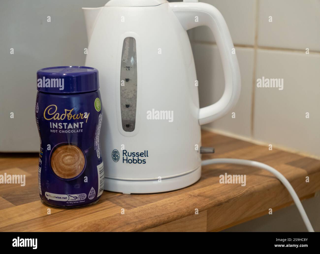Tub of hot chocolate and kettle in the kitchen Stock Photo - Alamy