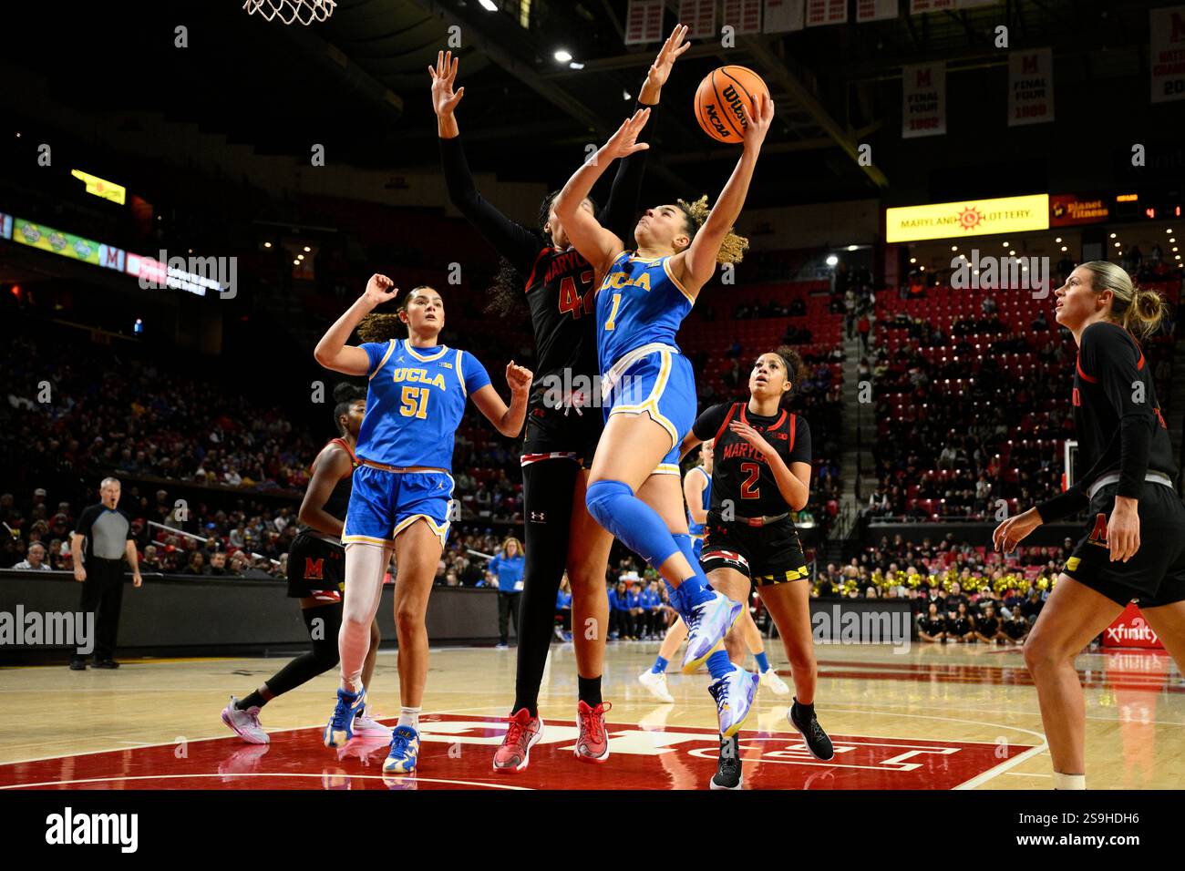 UCLA guard Kiki Rice (1) goes to the basket against Maryland forward ...