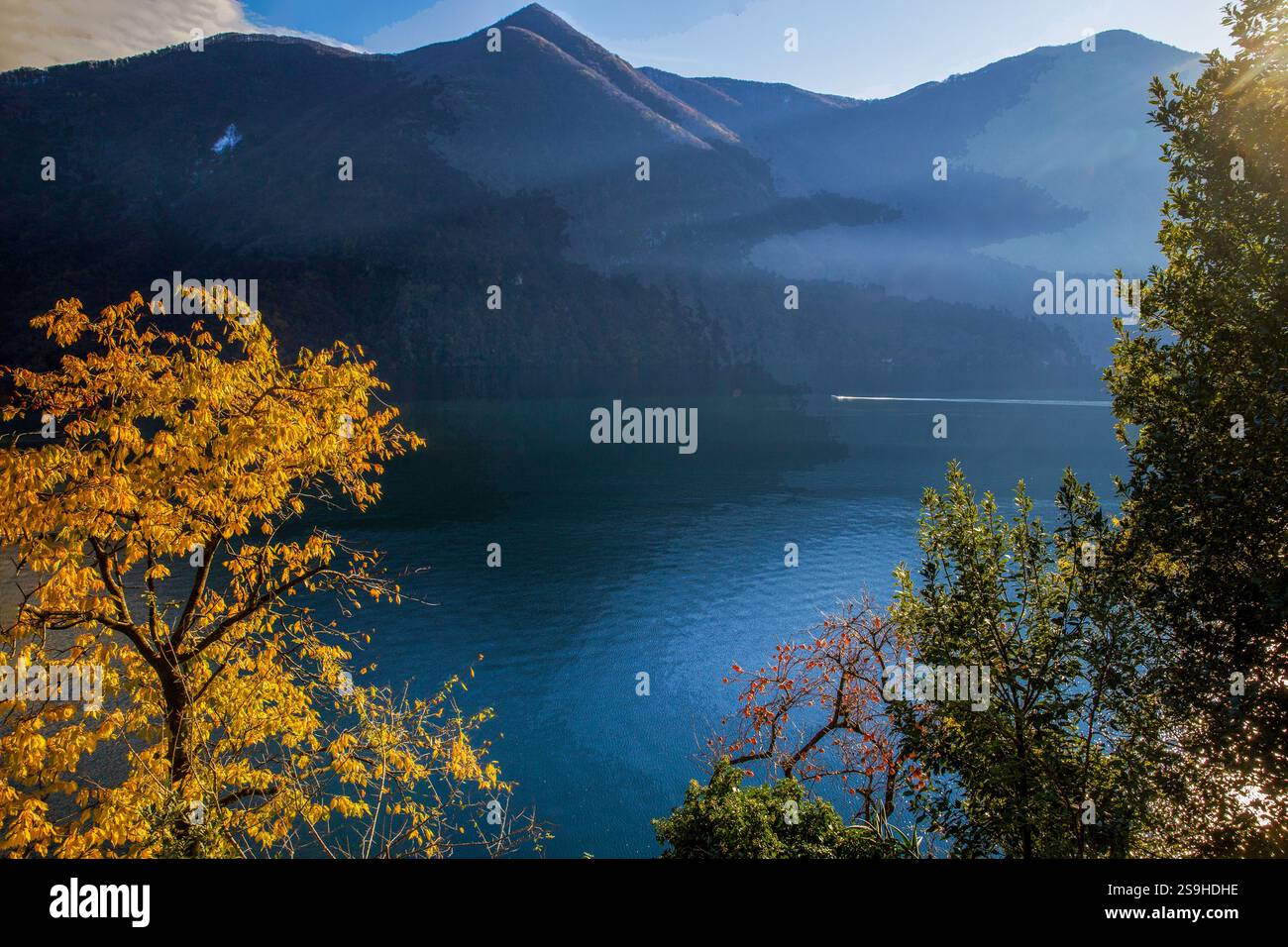 Amazing Autumn or winter view on Lake Lugano, Swiss Alps behind. Autumn ...