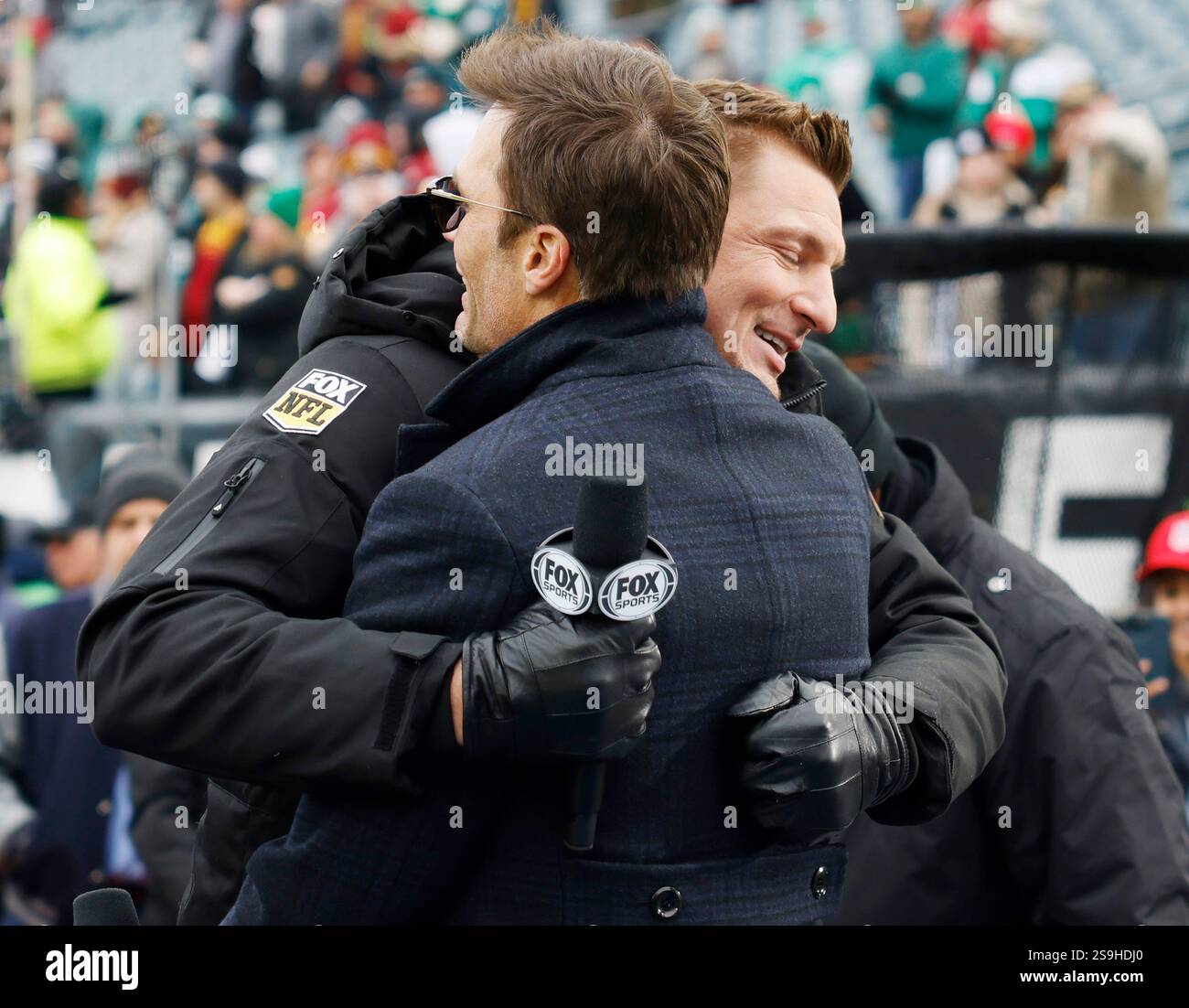 Philadelphia, United States. 26th Jan, 2025. Tom Brady is hugged by ...