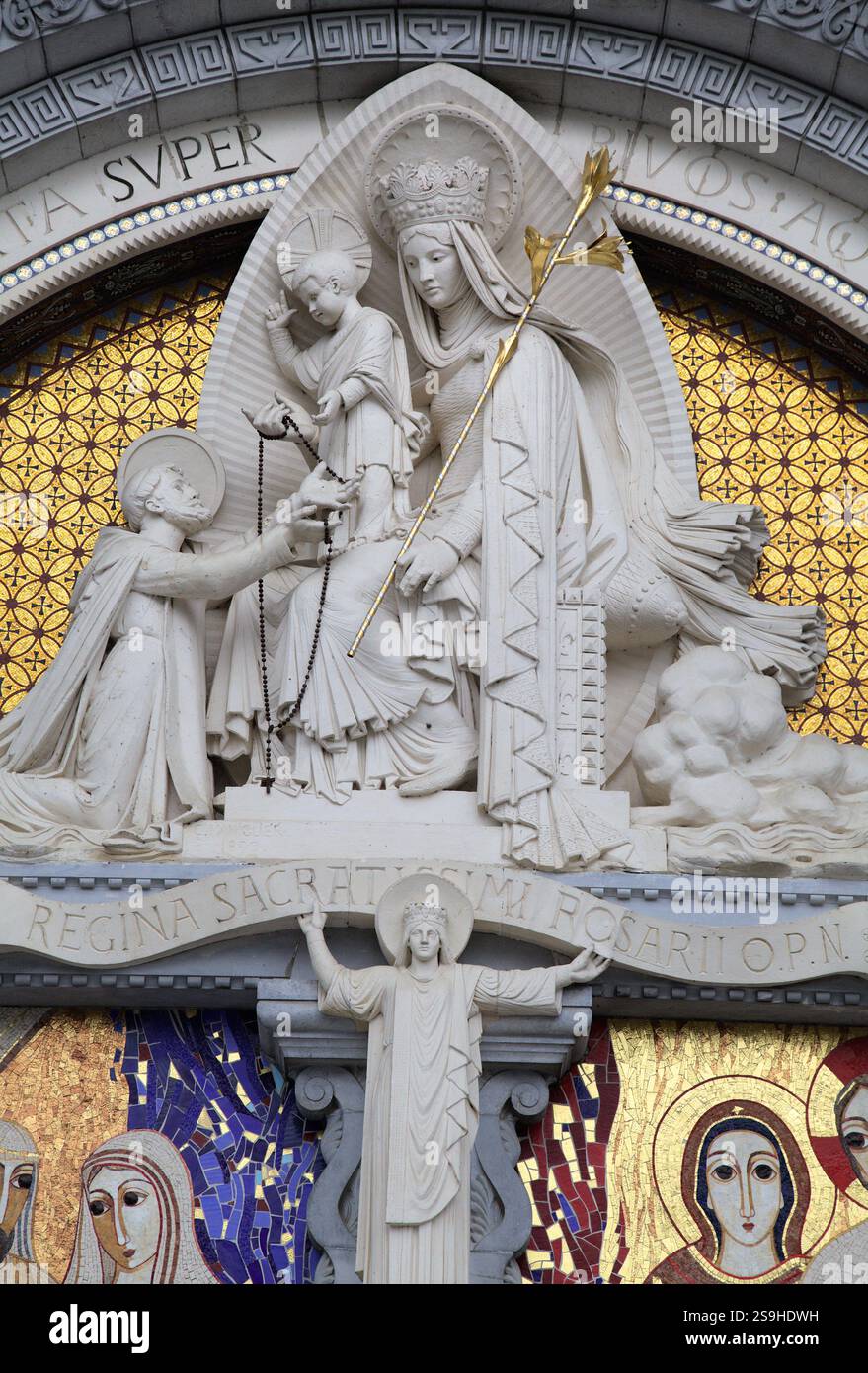 A beautiful Virgin Mary statue in Lourdes, encircled by stunning ...