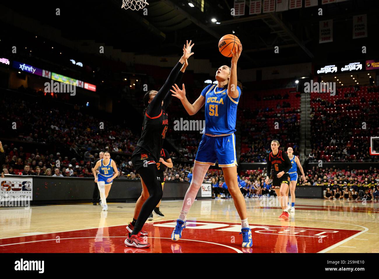 UCLA center Lauren Betts (51) goes to the basket against Maryland ...