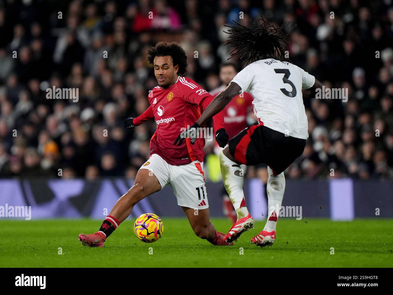 Manchester United's Joshua Zirkzee (left)and Fulham's Calvin Bassey ...