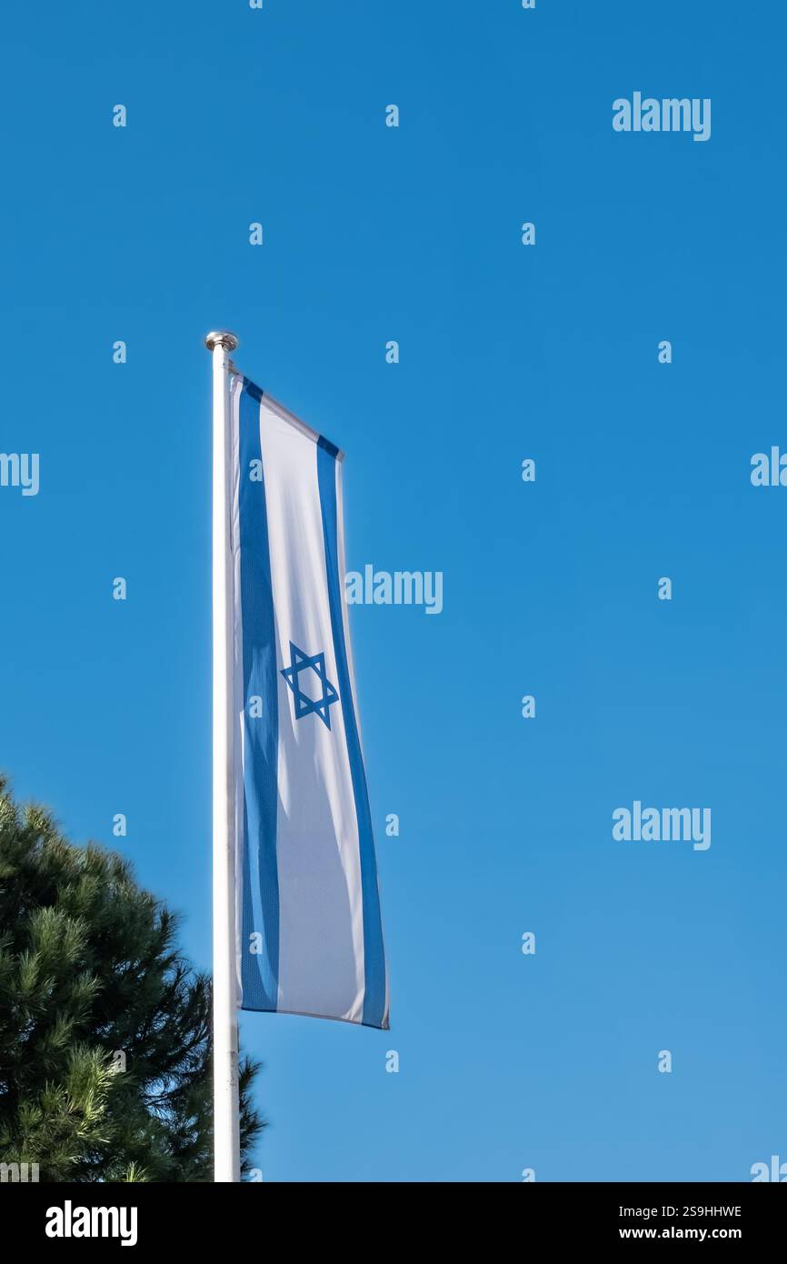 Israeli flag blowing in the wind. The national flag of the State of ...