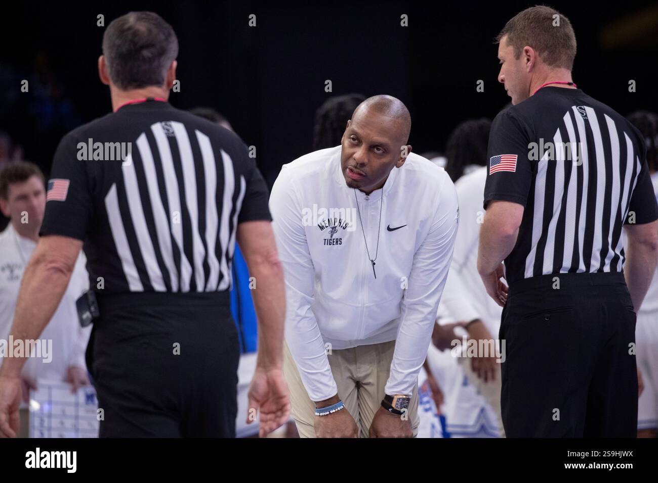 Memphis head coach Penny Hardaway, center, talks with game officials ...