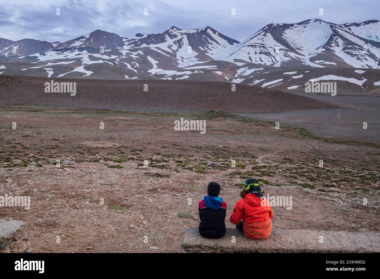 two children observing the top of Ighil M'Goun, 4,071 meters, Atlas ...