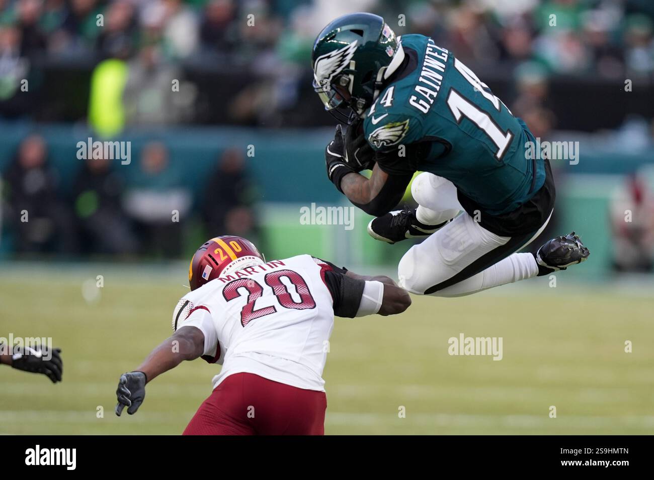 Philadelphia Eagles running back Kenneth Gainwell goes over the top of ...