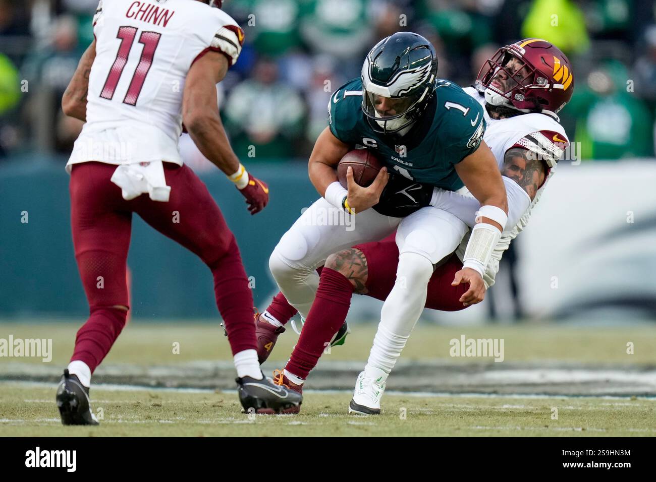 Philadelphia Eagles quarterback Jalen Hurts is sacked by Washington ...