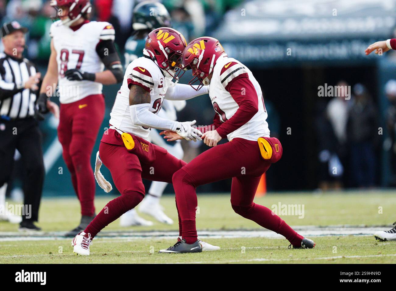 Washington Commanders punter Tress Way, right, celebrates with Jeremy ...