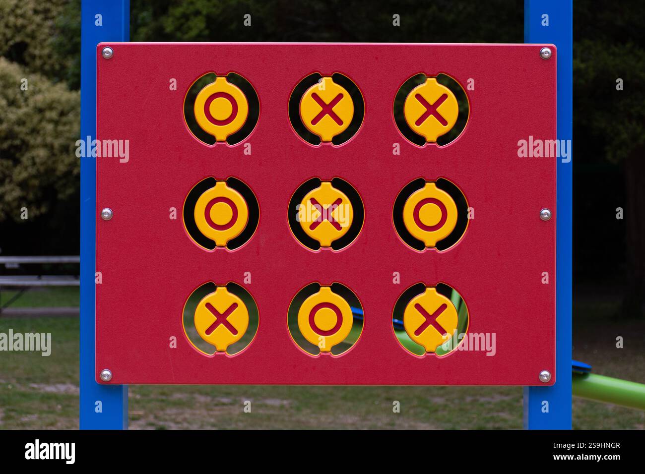 Red, Yellow, and blue tic-tac-toe in a childrens playground with X ...