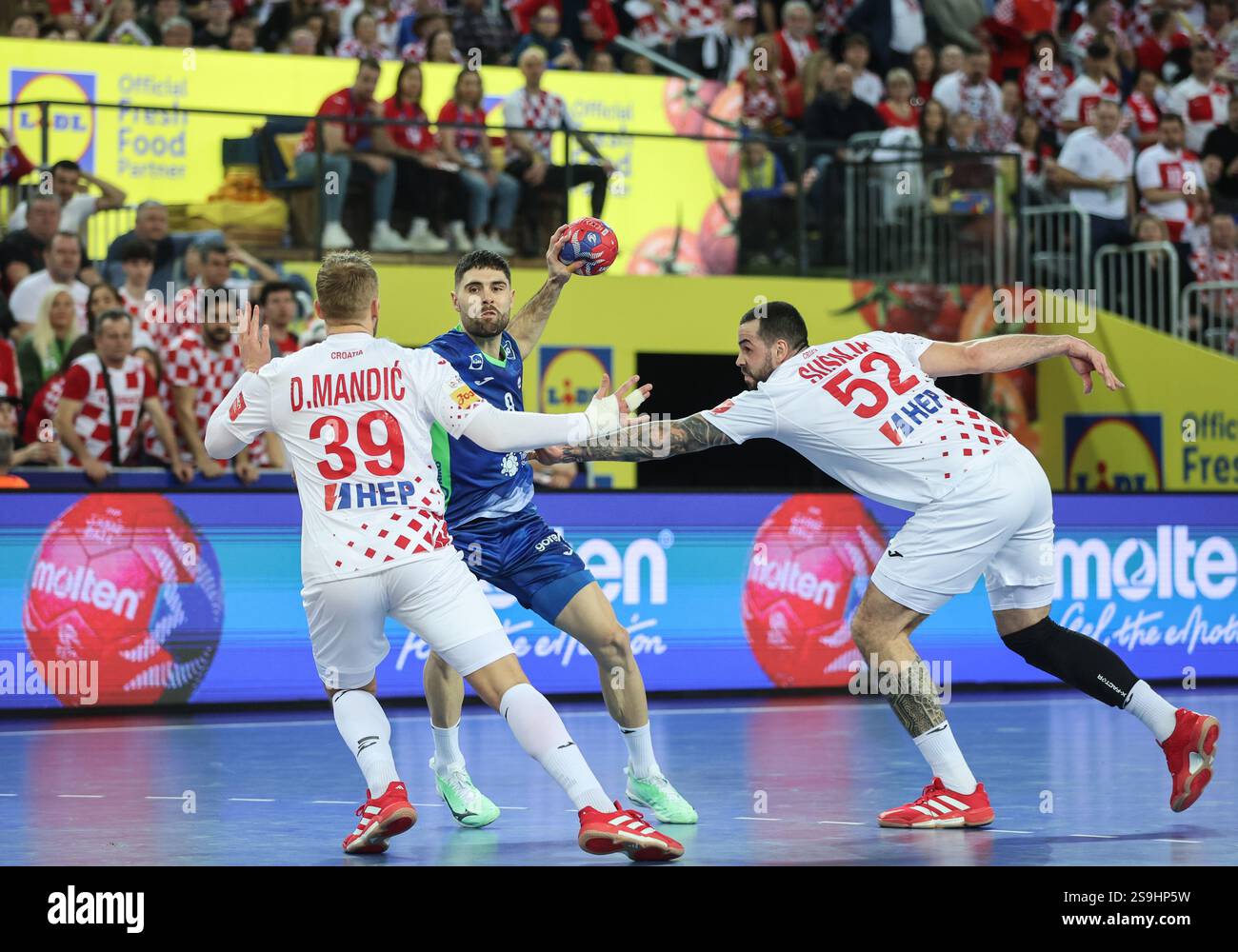 Blaz Janc of Slovenia shoots whilst under pressure from David Mandic ...