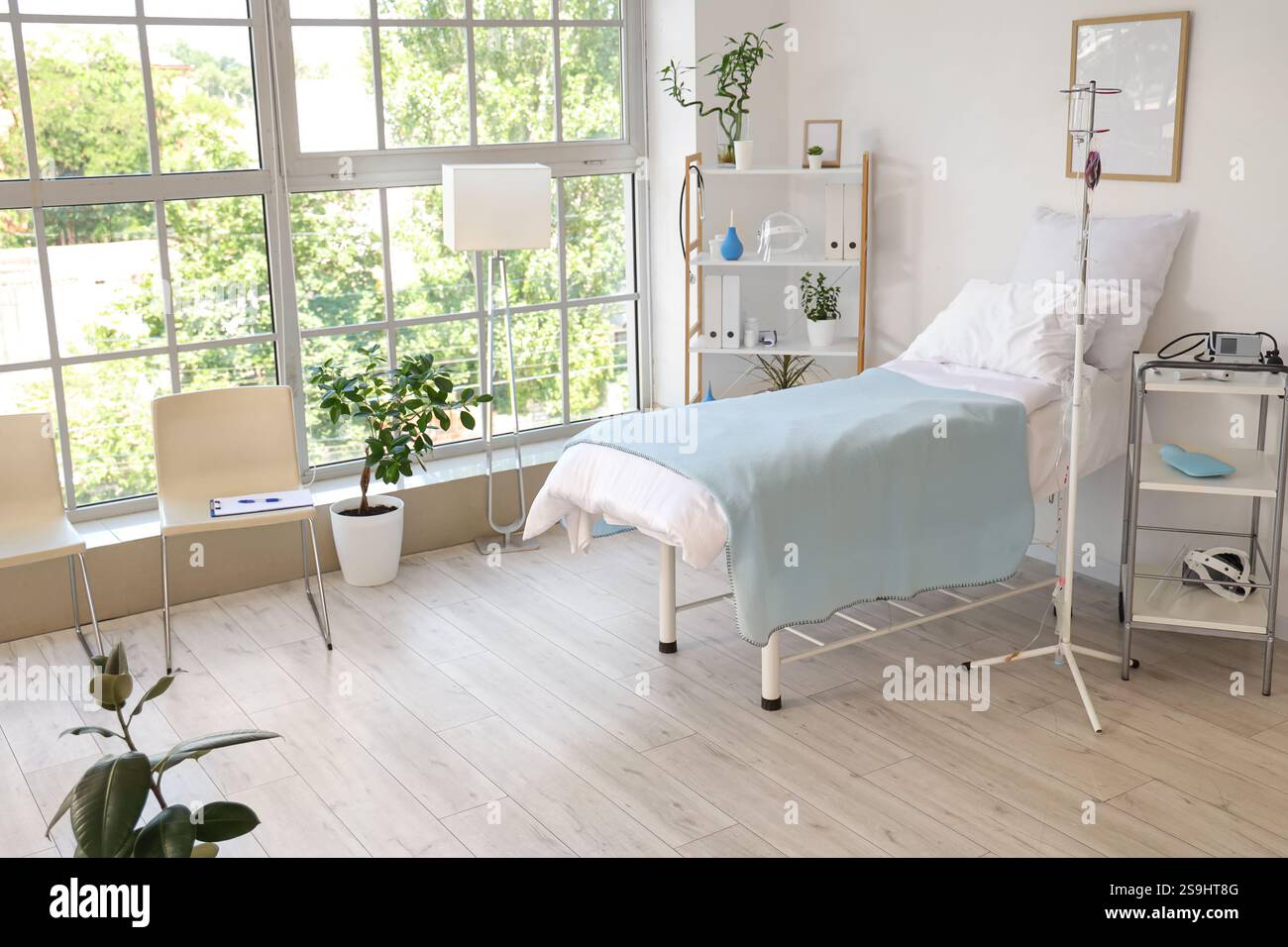 Interior of hospital ward with bed, drip infusion and shelf unit Stock ...
