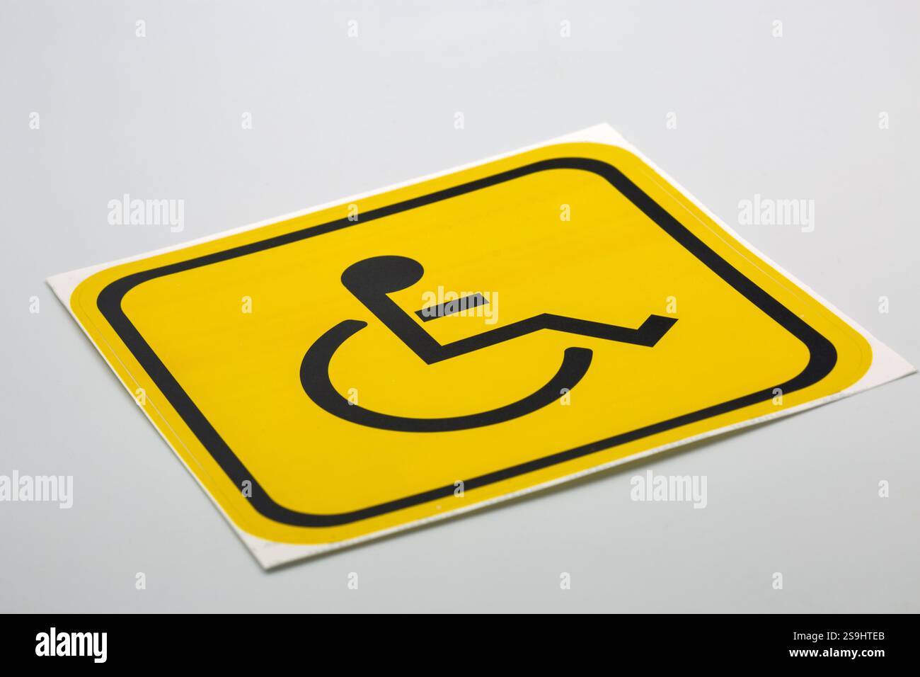 Studio shoot of yellow disability sign for placement on a vehicle ...