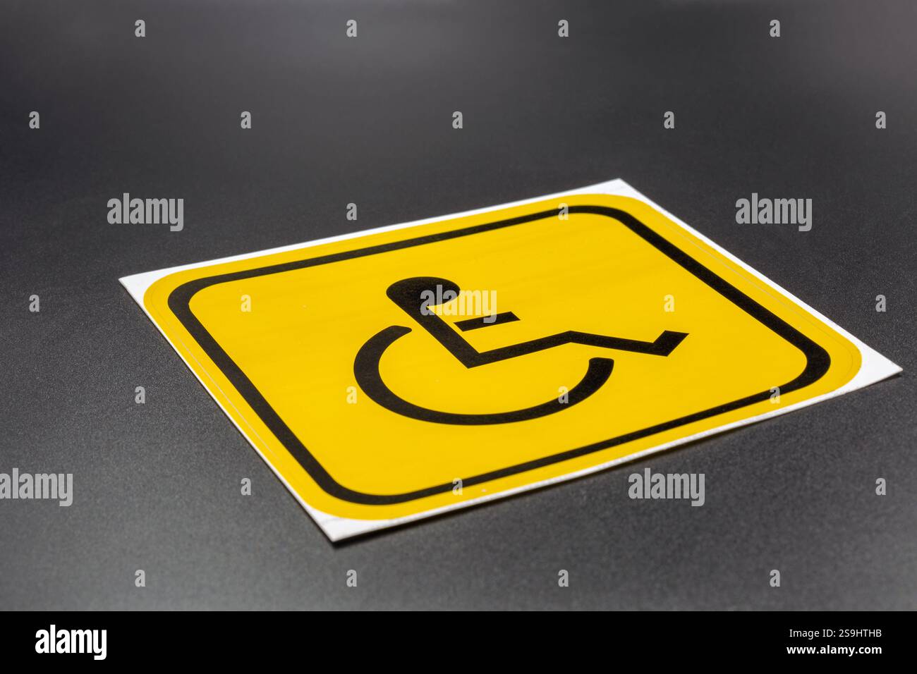 Studio shoot of yellow disability sign for placement on a vehicle ...